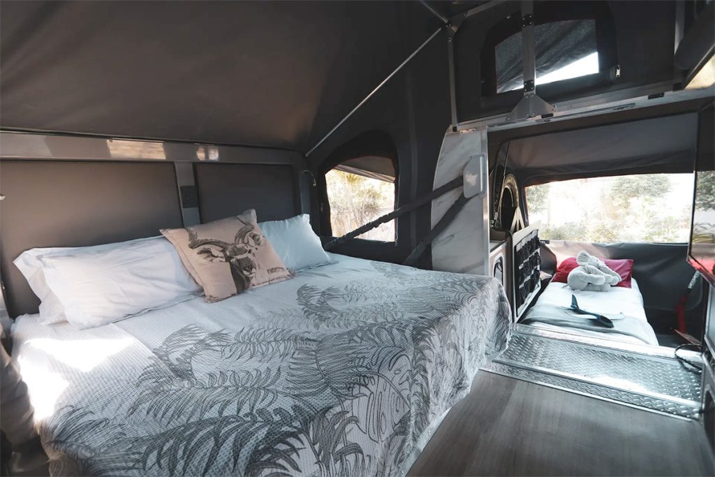 Badger Extreme camper trailer unfolds with a roof that transforms into ...