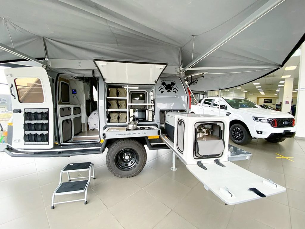 Badger Extreme camper trailer unfolds with a roof that transforms into ...
